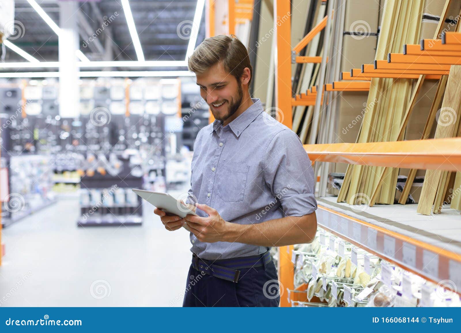 Manager Use His Tablet for Online Checking Products Available Stock ...