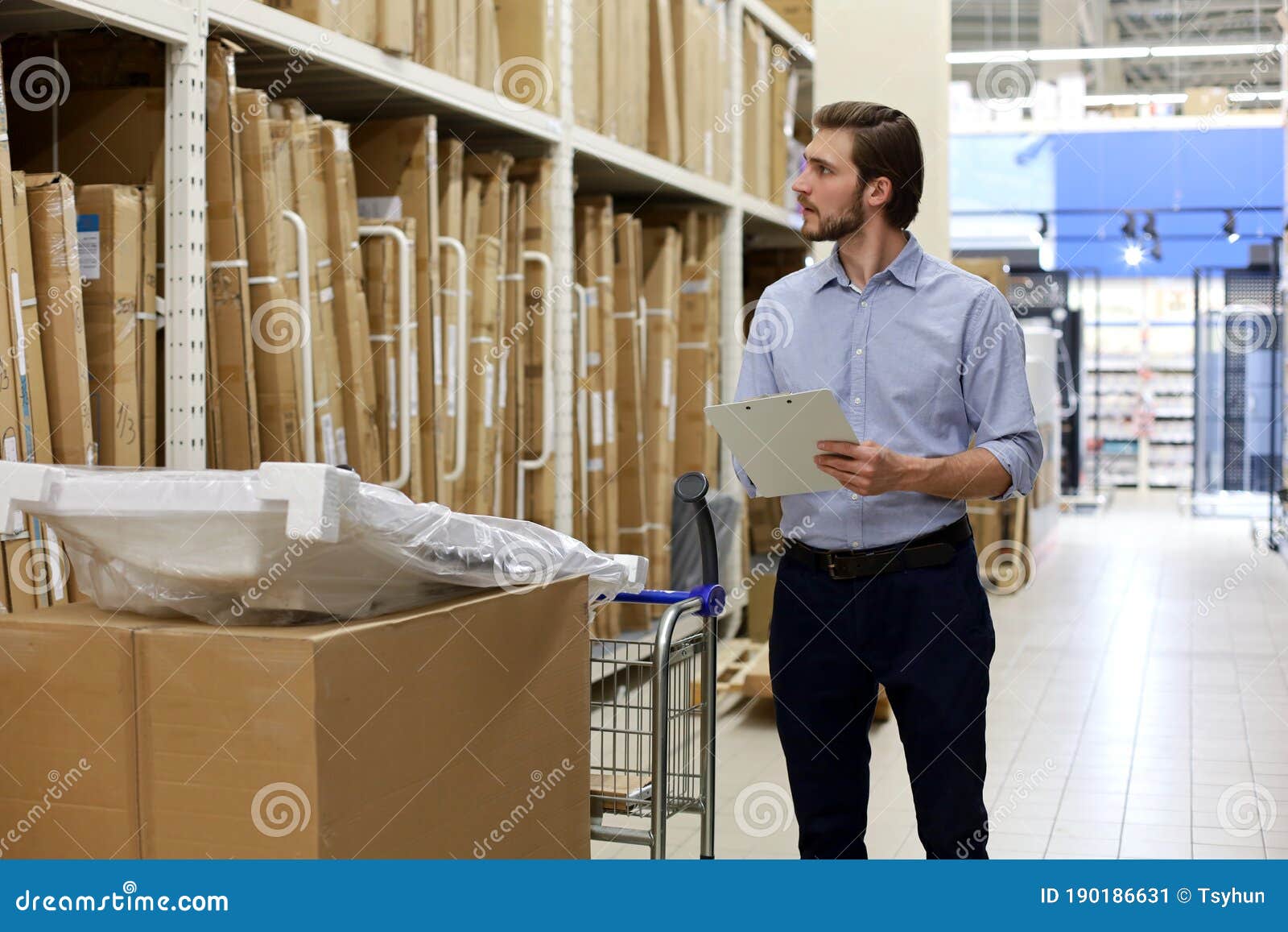 Manager Use His Tablet for Online Checking Products Available Stock ...