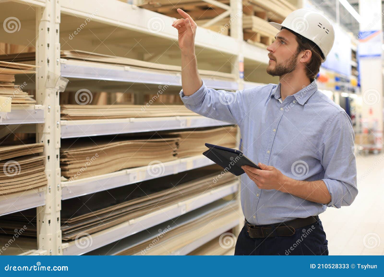 Manager Use His Tablet for Online Checking Products Available Stock ...