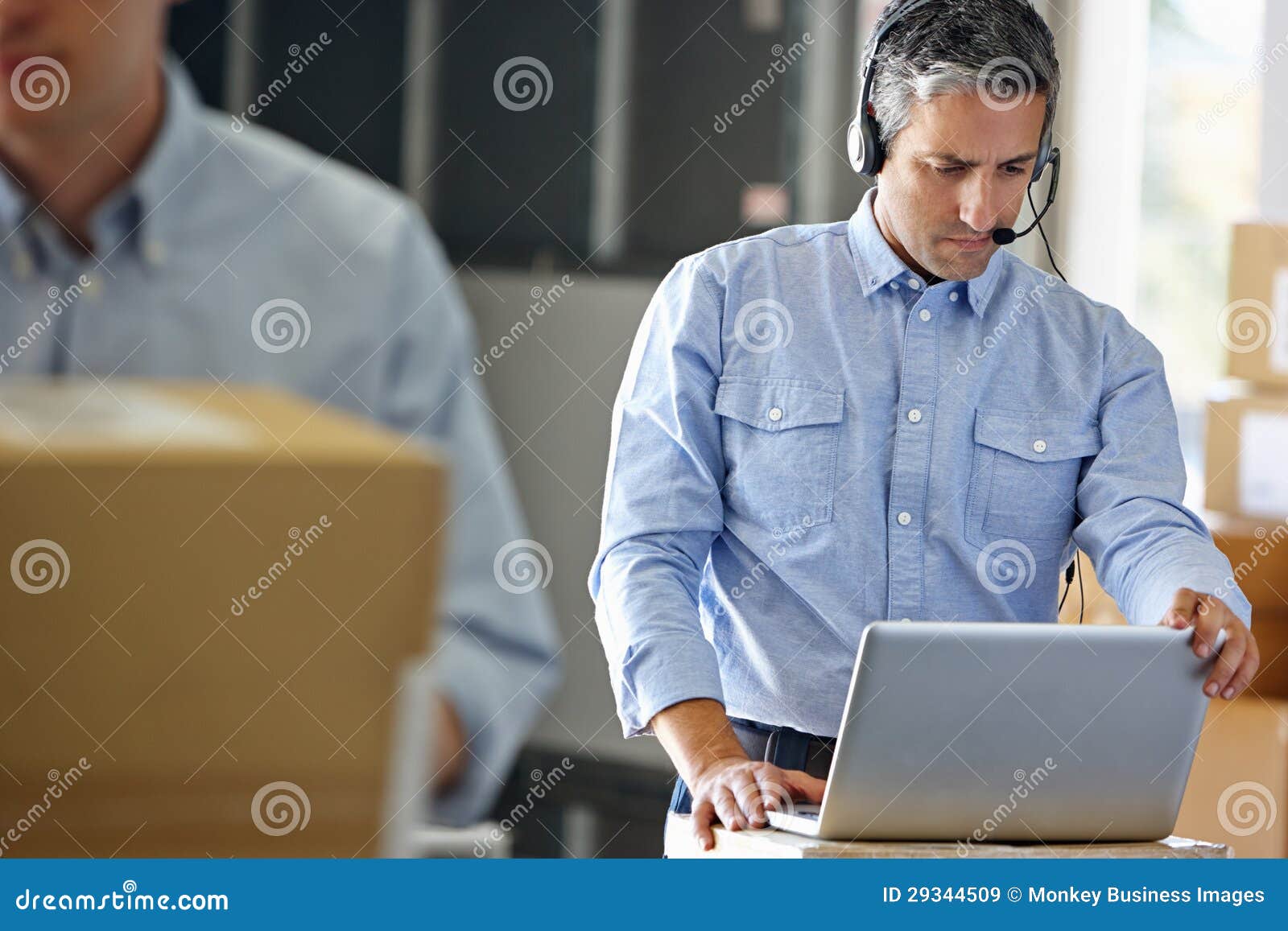 Manager Using Headset in Distribution Warehouse Stock Image - Image of ...