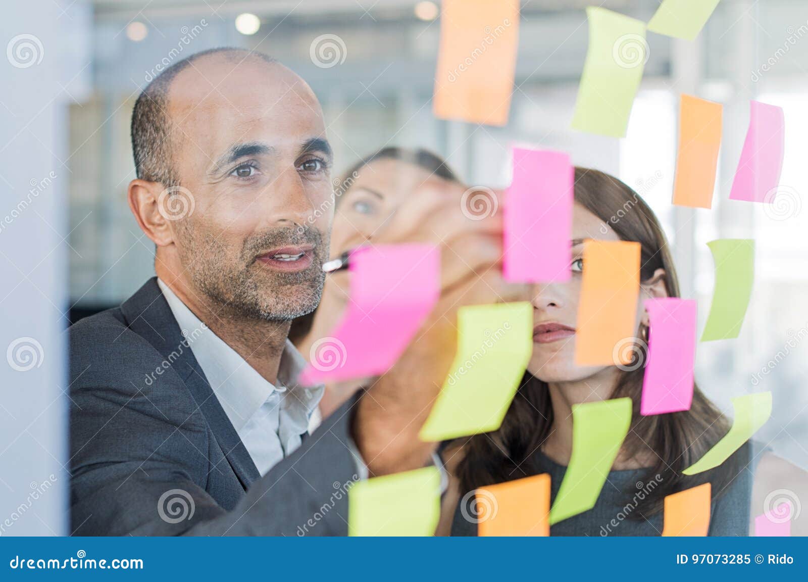 Manager using sticky notes stock image. Image of corporate - 97073285