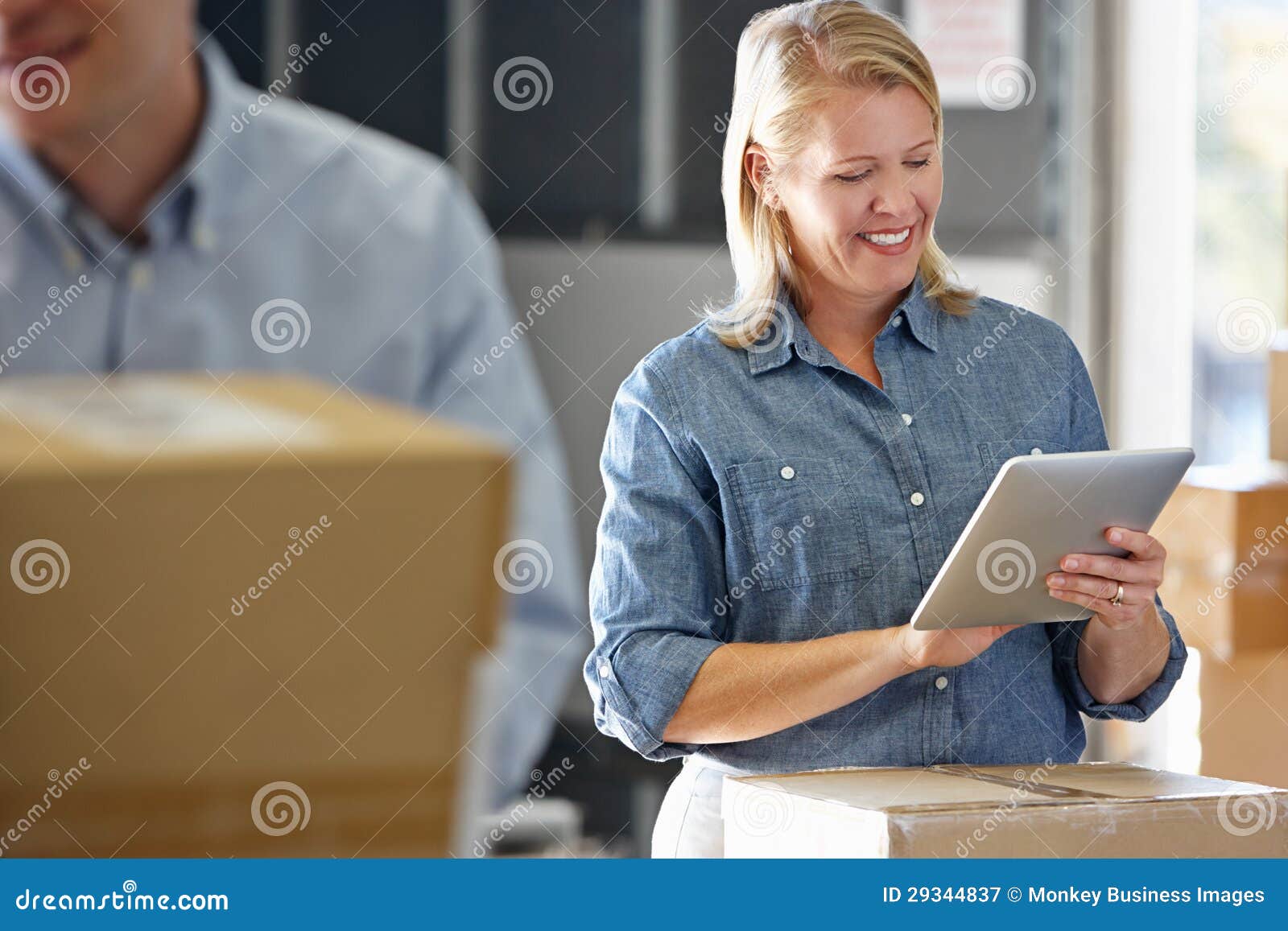 Manager Using Tablet Computer in Distribution Warehouse Stock Image ...