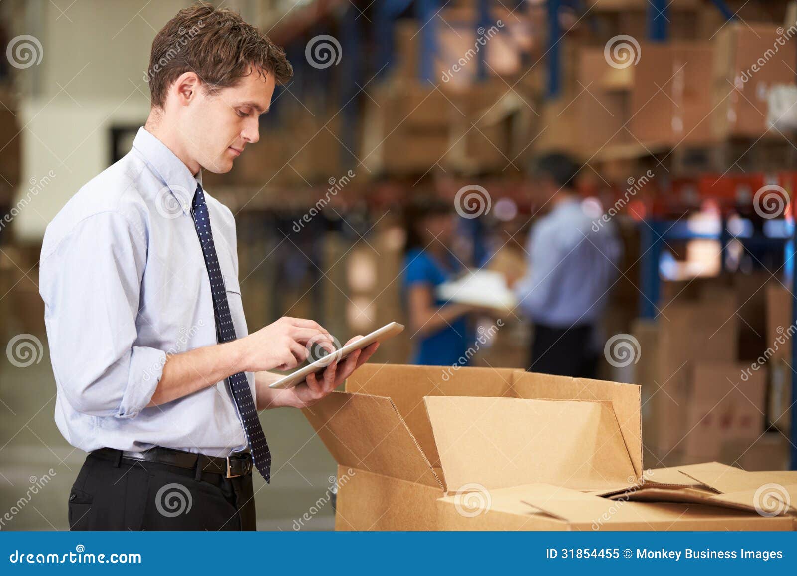Manager in Warehouse Checking Boxes Using Digital Tablet Stock Image ...