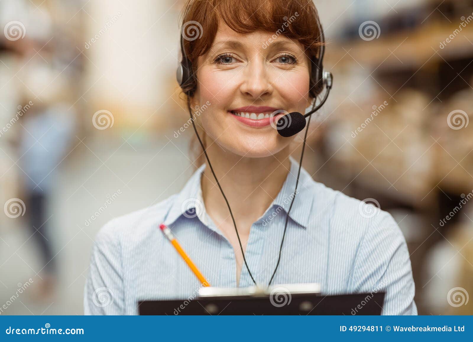 Manager Wearing a Headset while Holding Clipboard Stock Image - Image ...