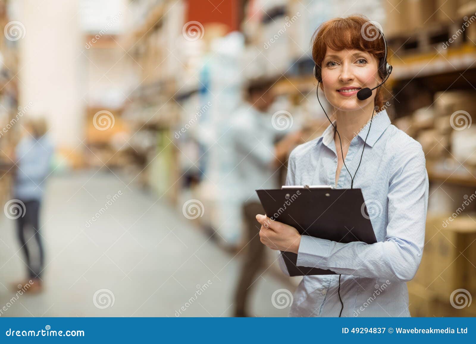 Manager Wearing a Headset while Holding Clipboard Stock Image - Image ...