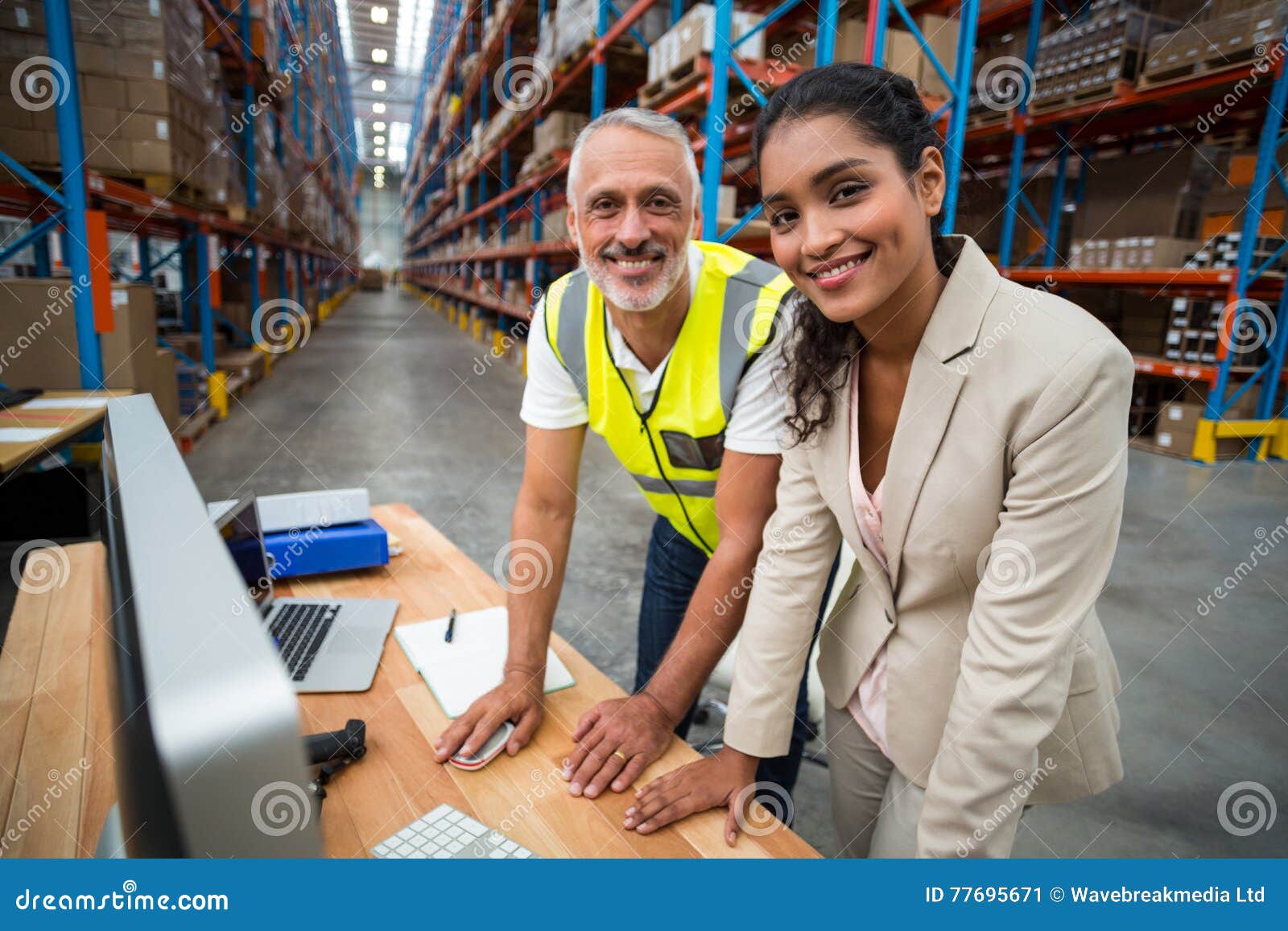 Manager and Worker are Posing and Looking the Camera during Work on ...