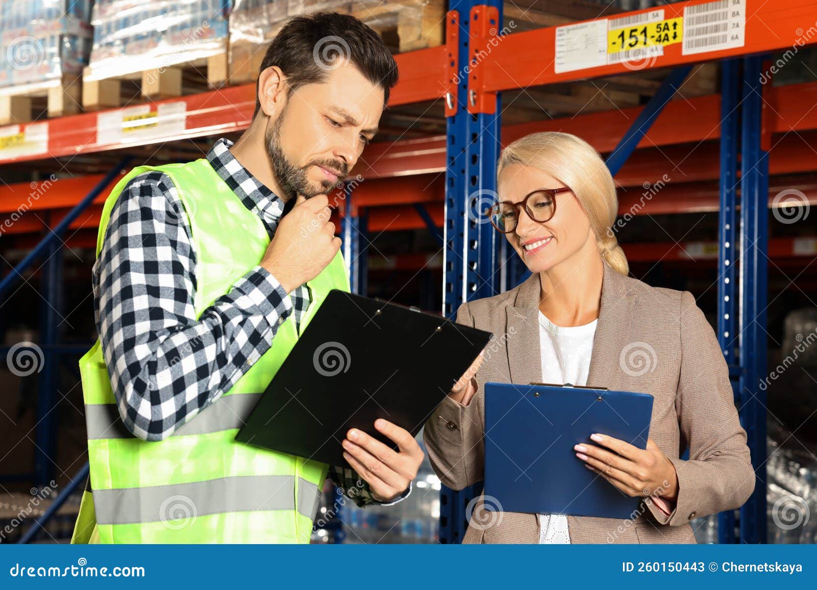 Manager and Worker in Warehouse with Lots of Products Stock Image ...