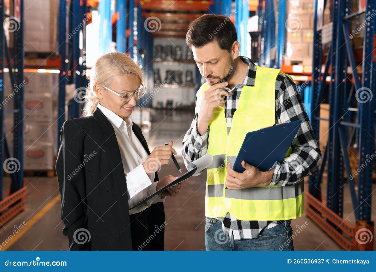Manager and Worker in Warehouse with Lots of Products Stock Image ...