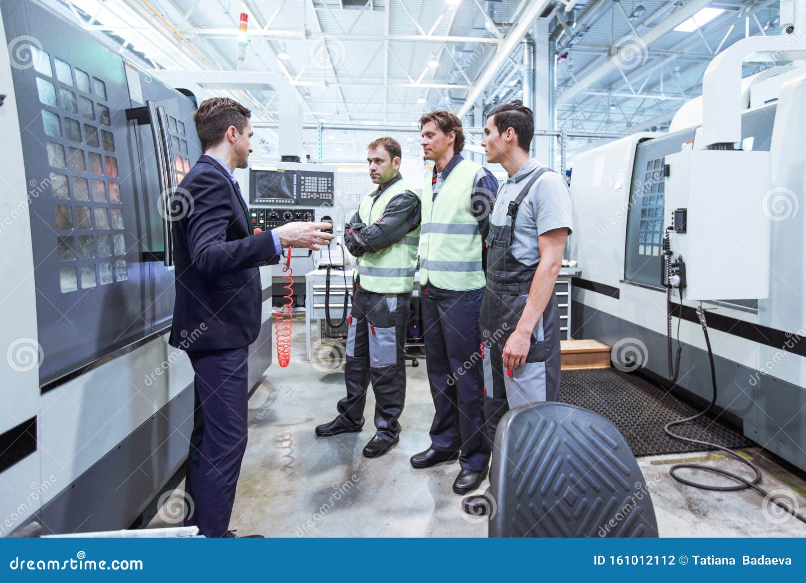 Manager and Workers Near CNC Machines Stock Photo - Image of ...