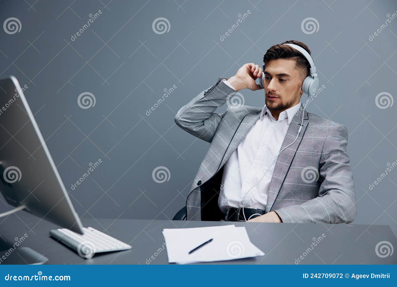 Manager Working at the Computer in Headphones in the Office Isolated ...