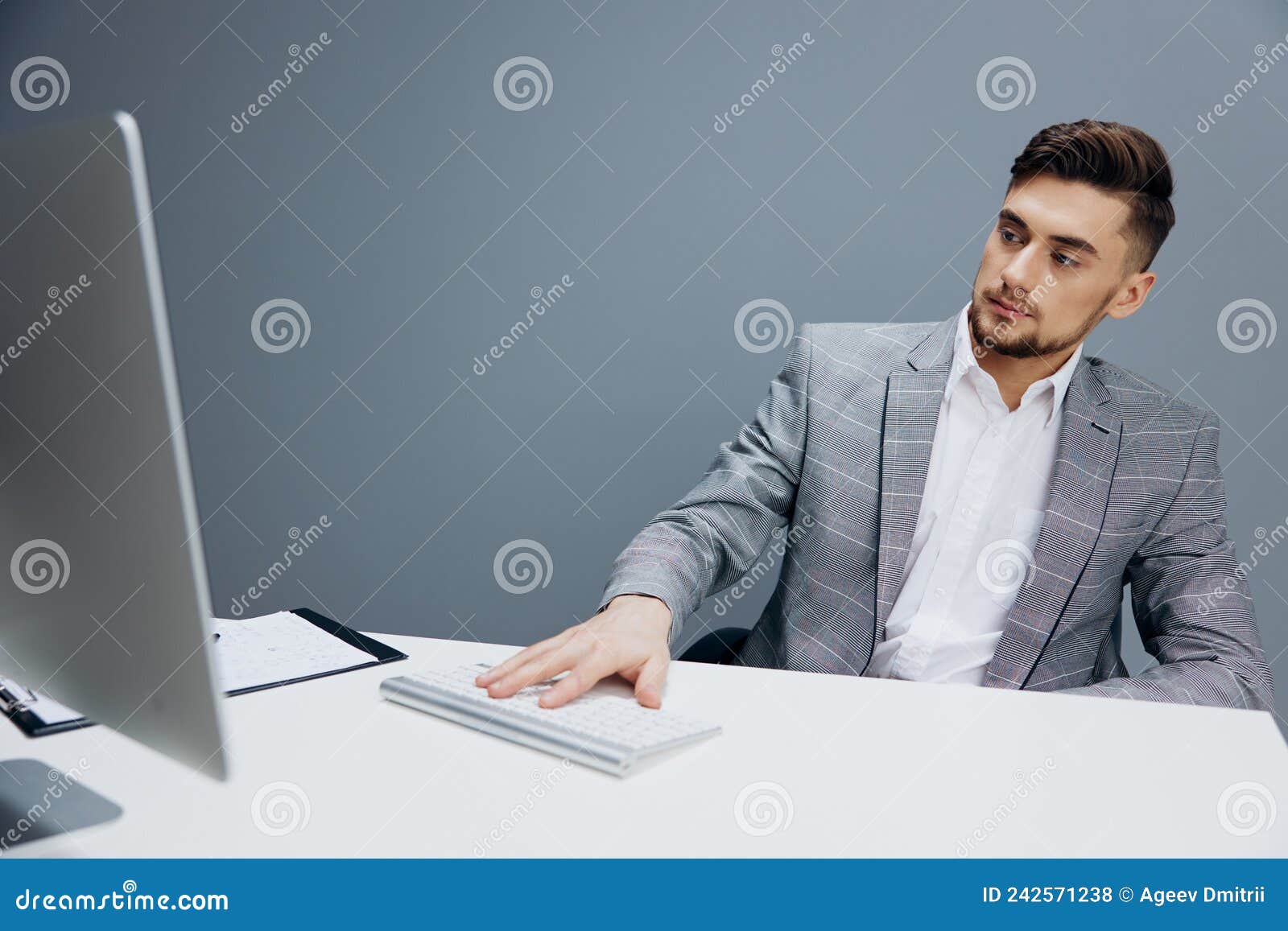 Manager Working at the Computer in the Office Gray Background Stock ...