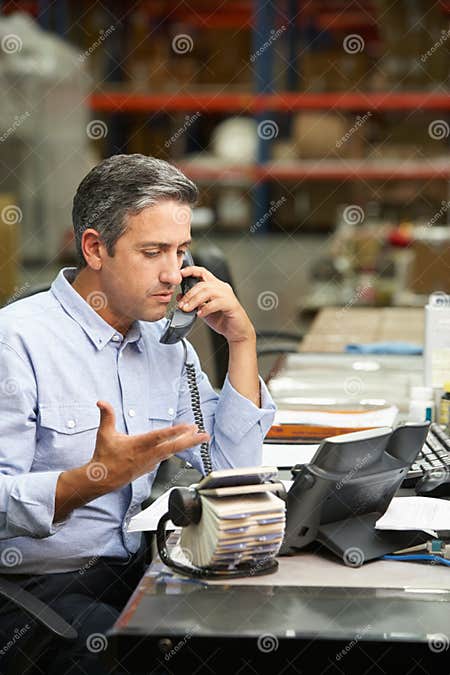 Manager Working at Desk in Warehouse Stock Photo - Image of dispatch ...