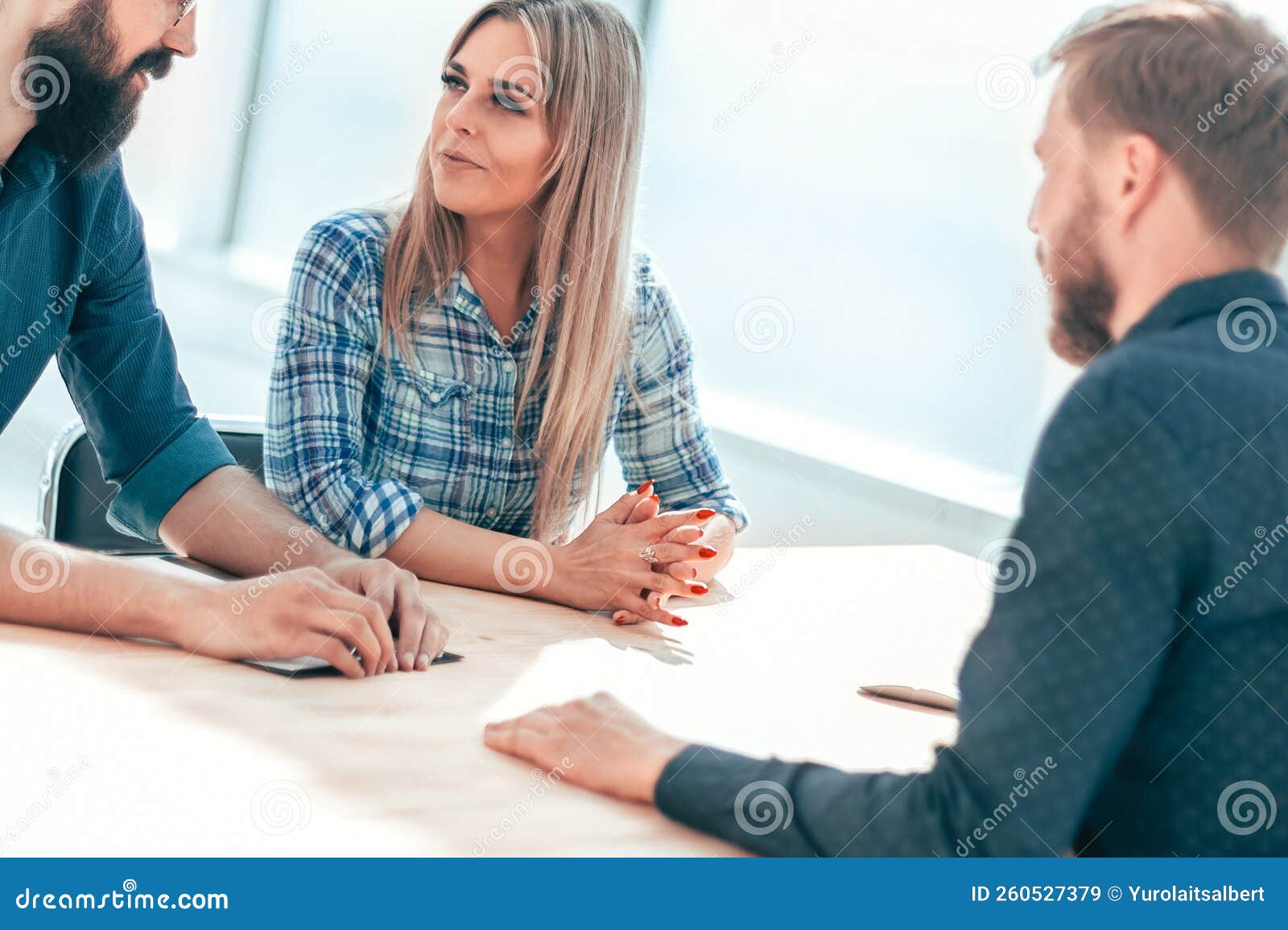 Managers Discussing the Results of an Interview with a Young Employee ...