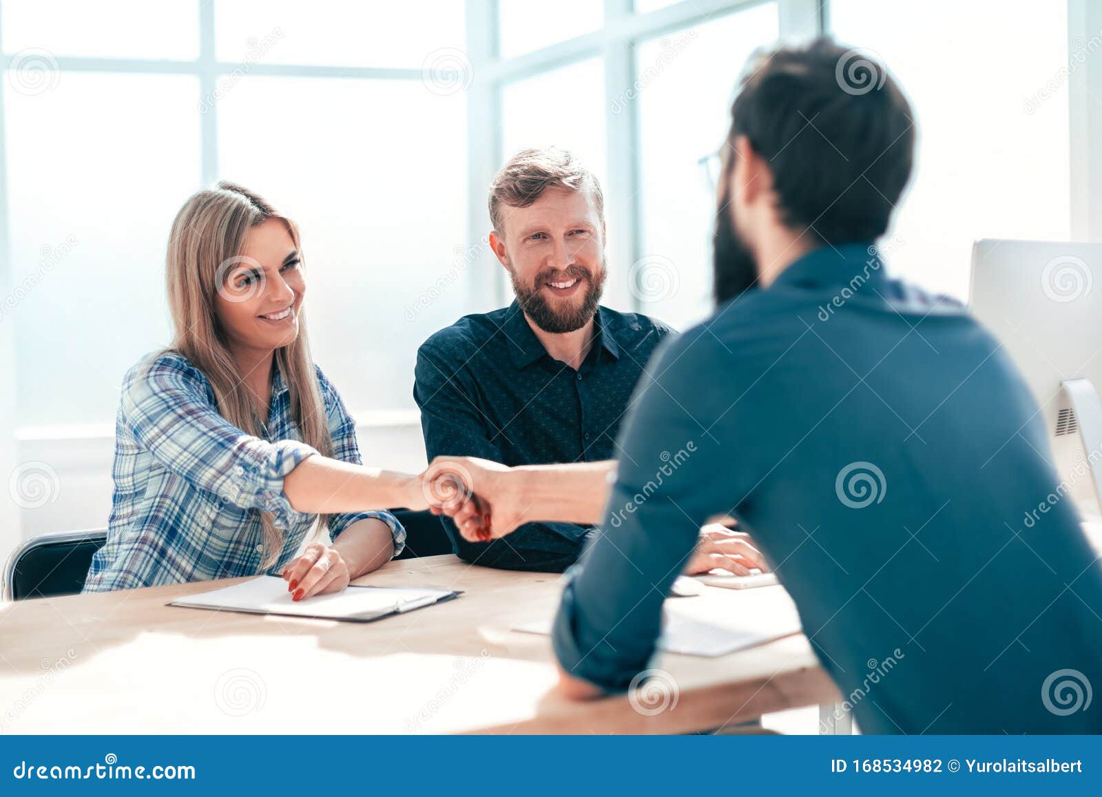 Managers Interview the Applicant Sitting at the Office Table. Stock ...
