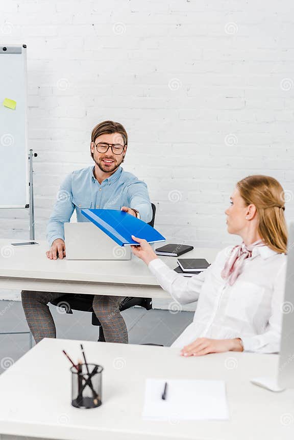 Managers Passing Folder with Documents Stock Image - Image of ...