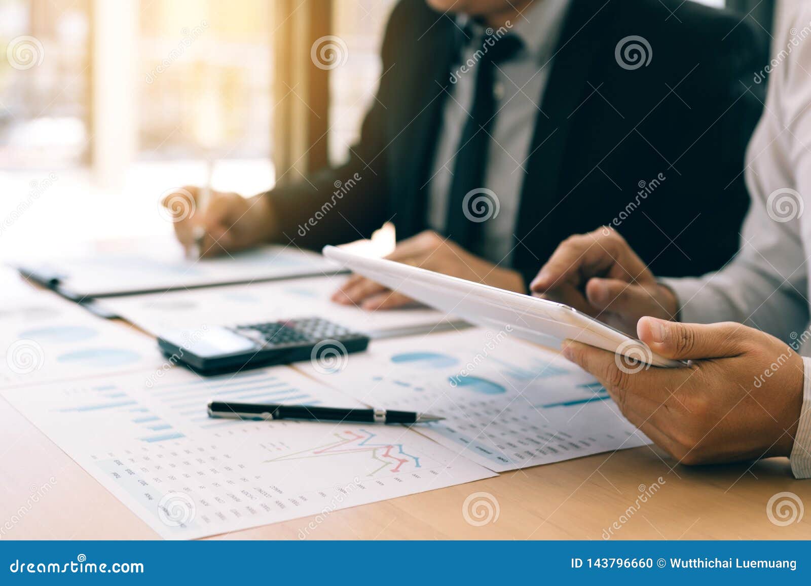 Managers are Using Tablets To Analyze Sales Cost Reports and Explain ...