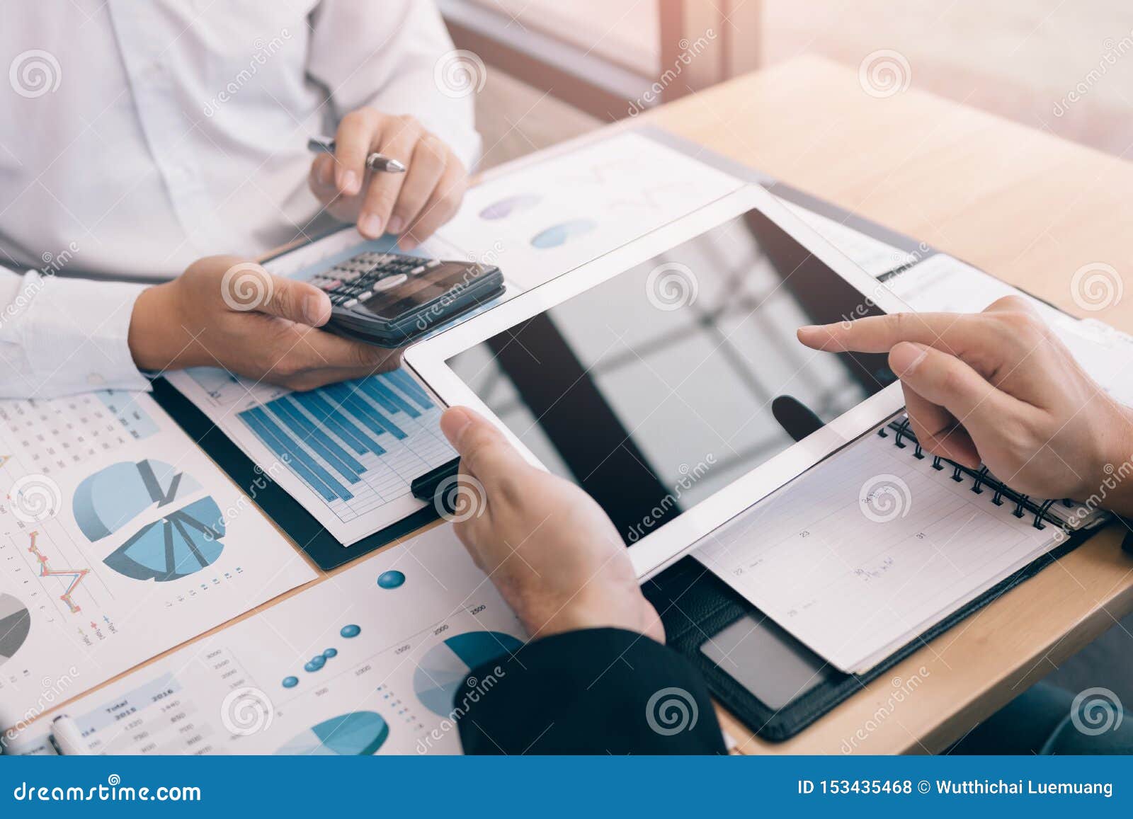 Managers are Using Tablets To Analyze Sales Cost Reports and Explain ...