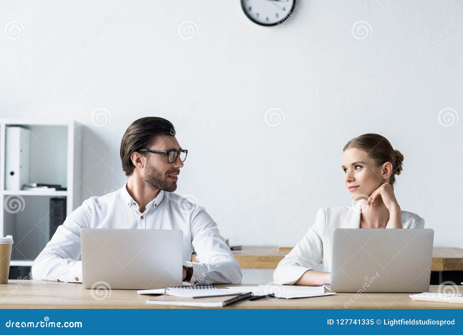 Managers Working with Laptops Together at Office and Looking Stock ...