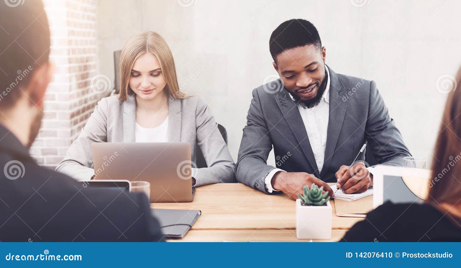 Managers Working in Office, Using Laptop and Writing Ideas Stock Photo ...