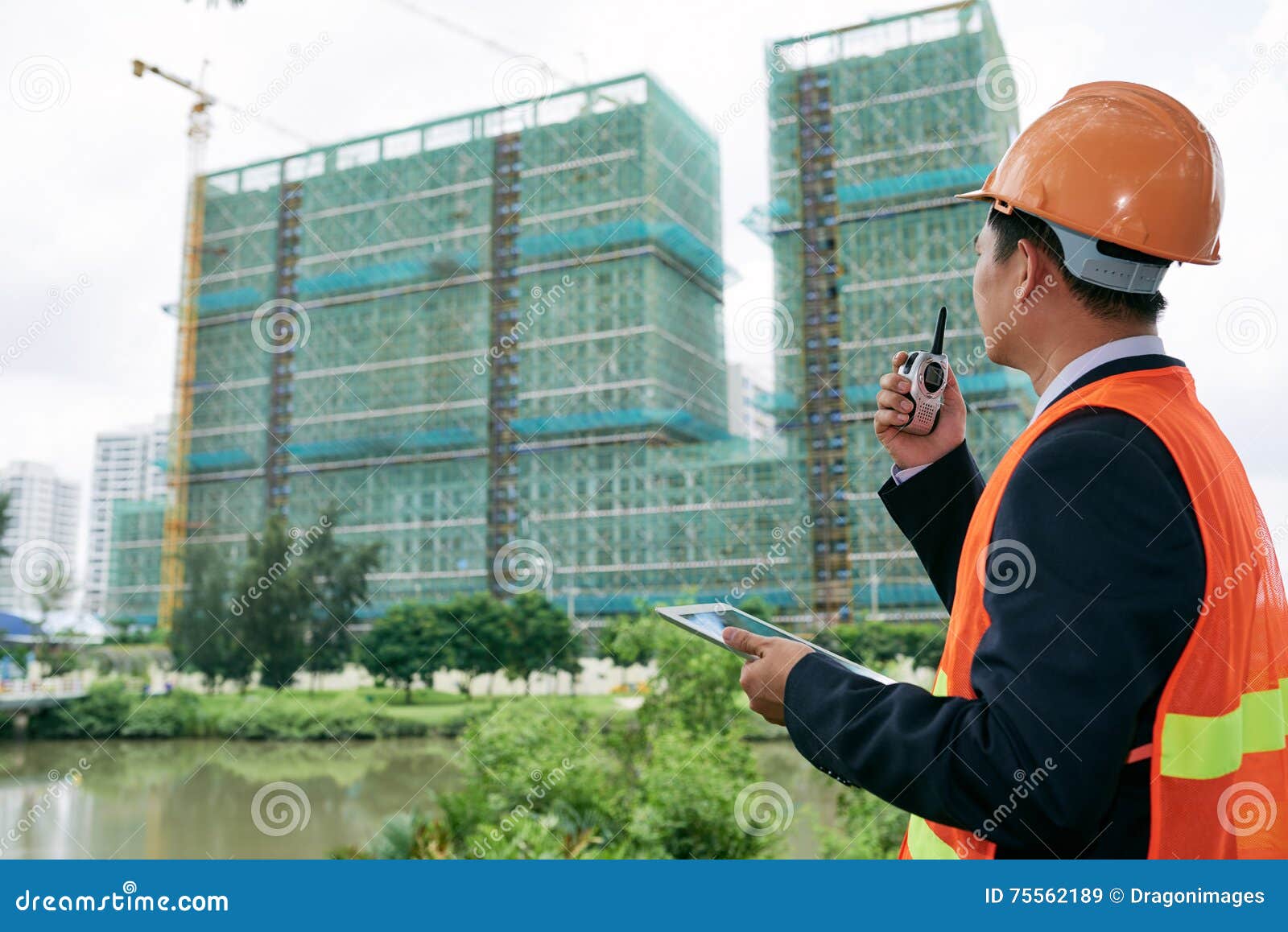 Managing construction work stock image. Image of construction - 75562189