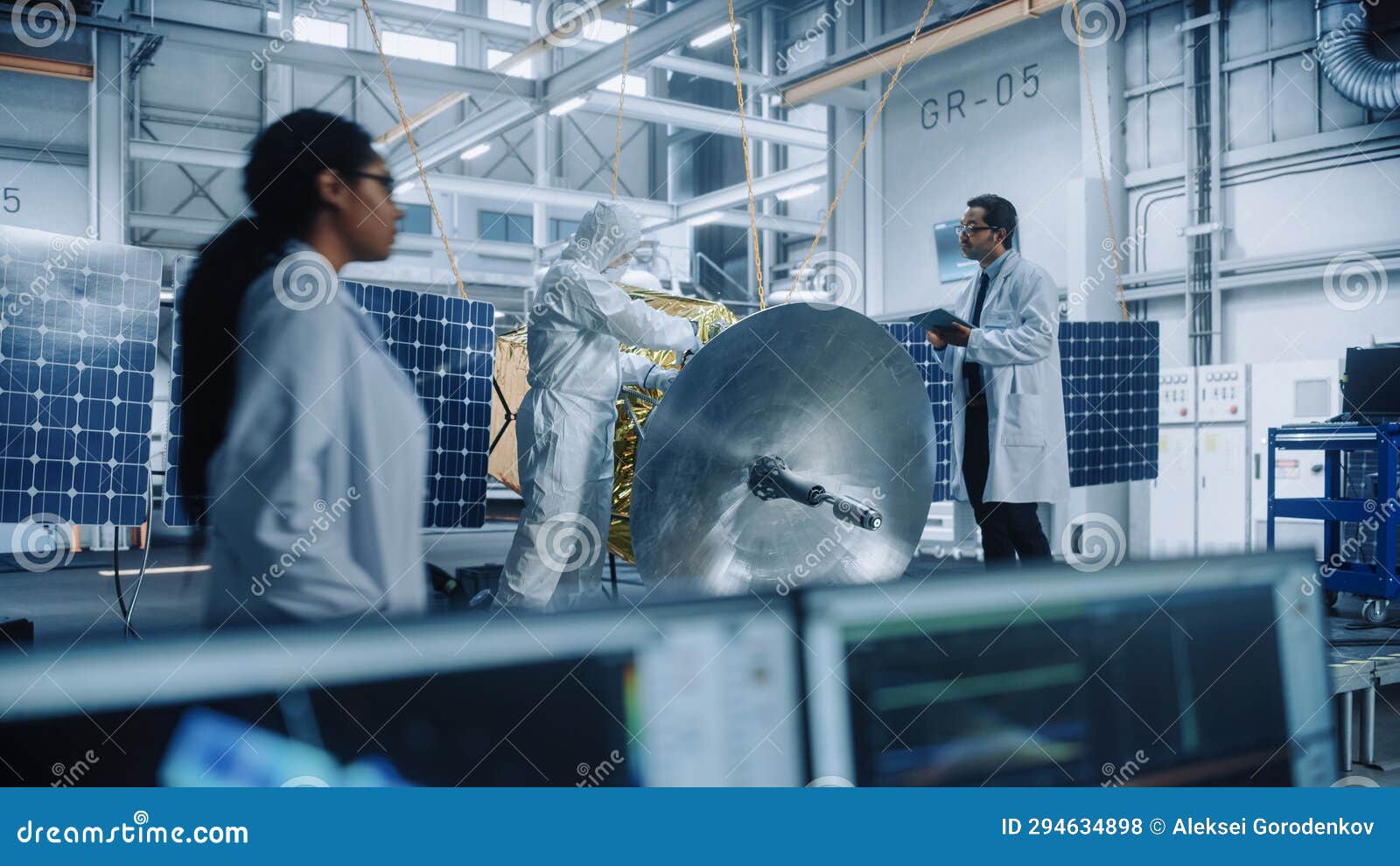 Managing Engineer and Chief Technician Working on Satellite ...