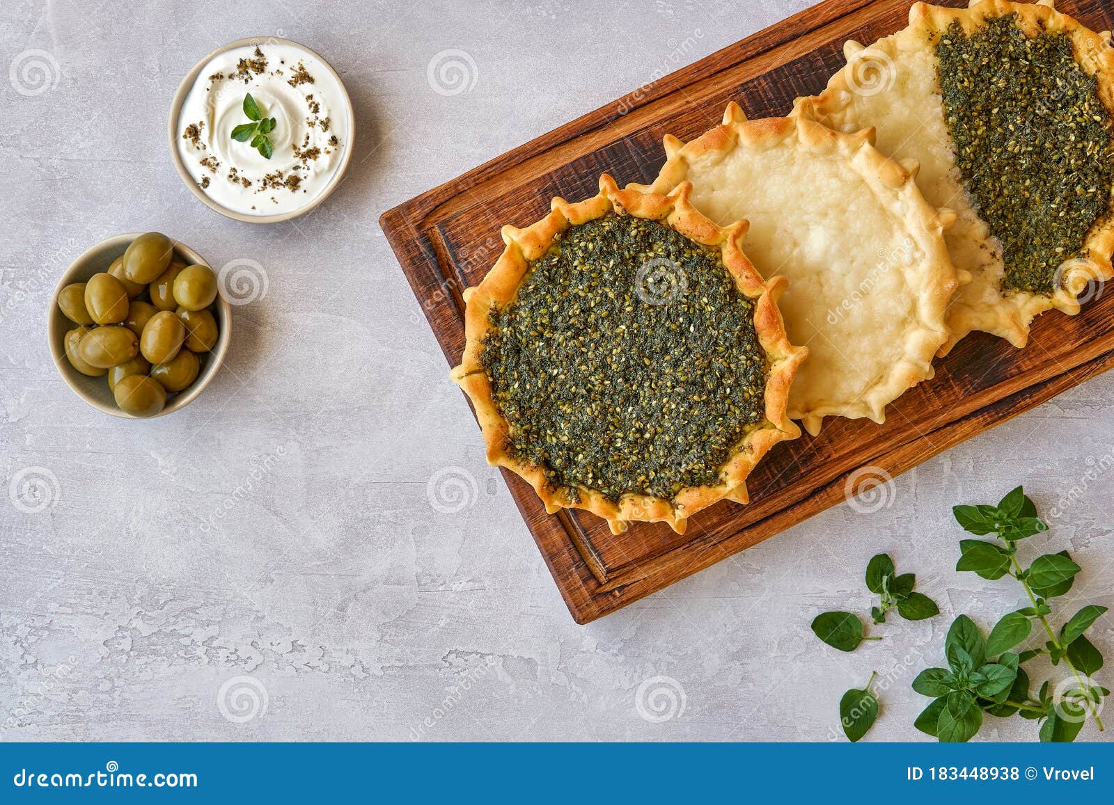 Manakeesh with Zaatar and White Cheese on Wooden Board. Top View Stock ...