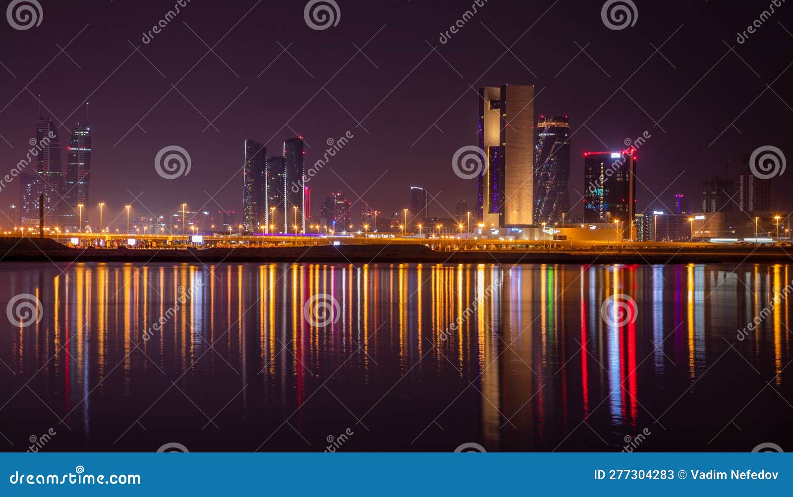 Manama Illuminated Downtown on the Shore Reflected in Waters of Persian ...
