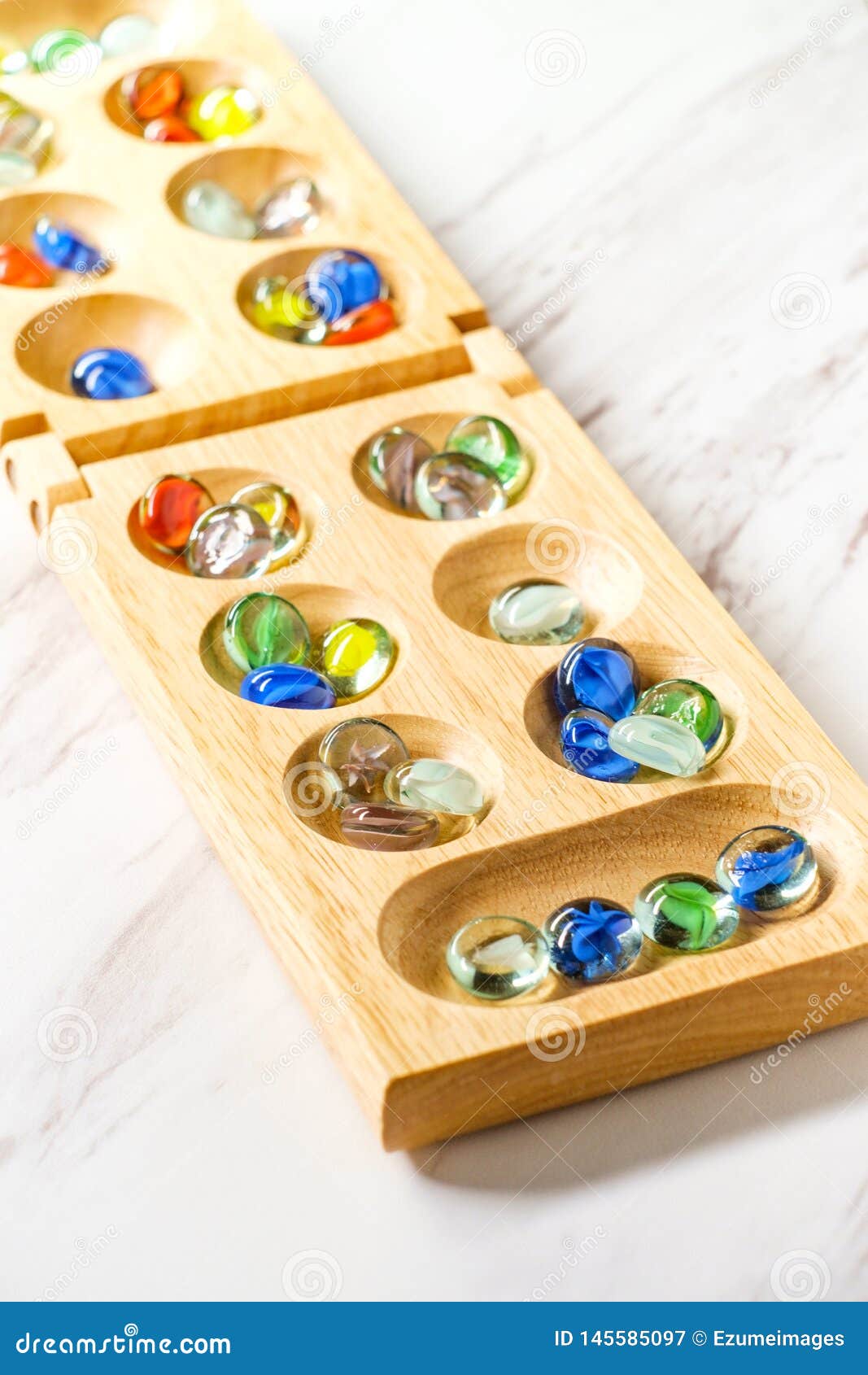 Mancala Board Game stock image. Image of games, table - 145585097