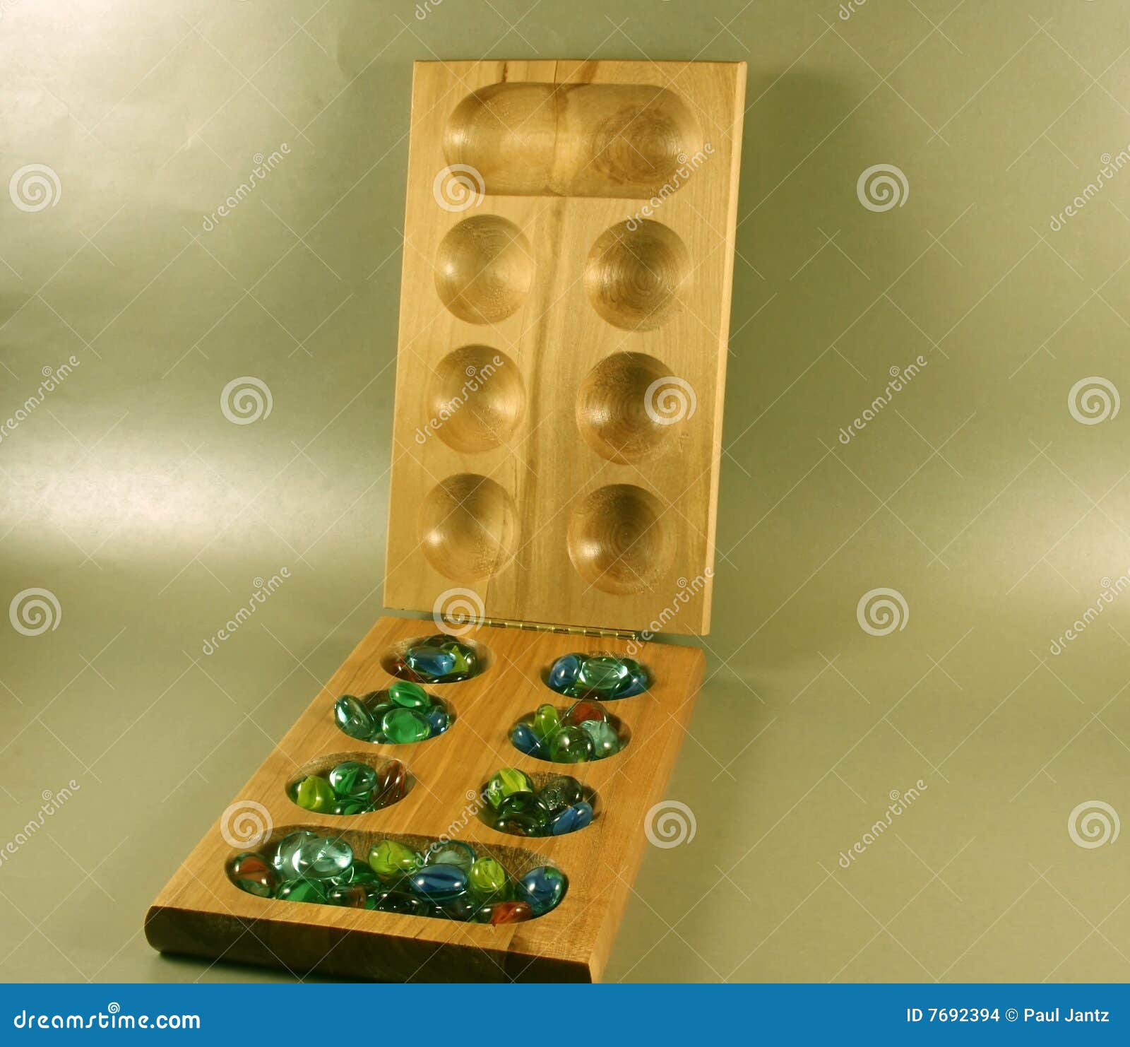Mancala board and stones stock photo. Image of cups, play - 7692394