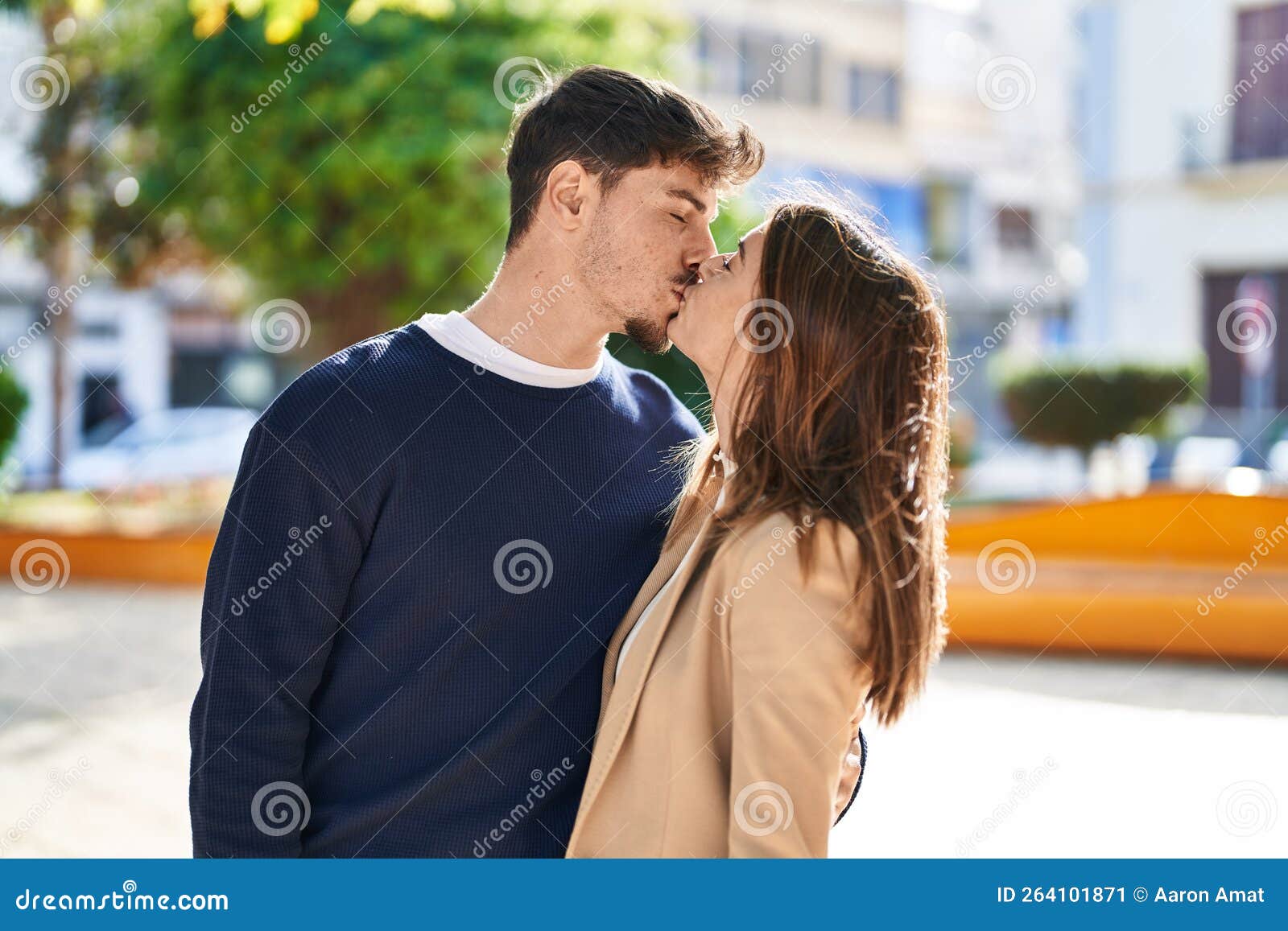 Mand And Woman Couple Hugging Each Other And Kissing At Park Stock