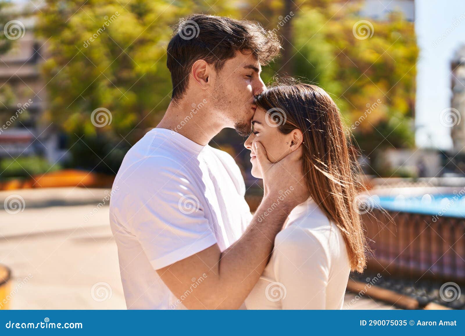Mand And Woman Couple Hugging Each Other And Kissing At Park Stock