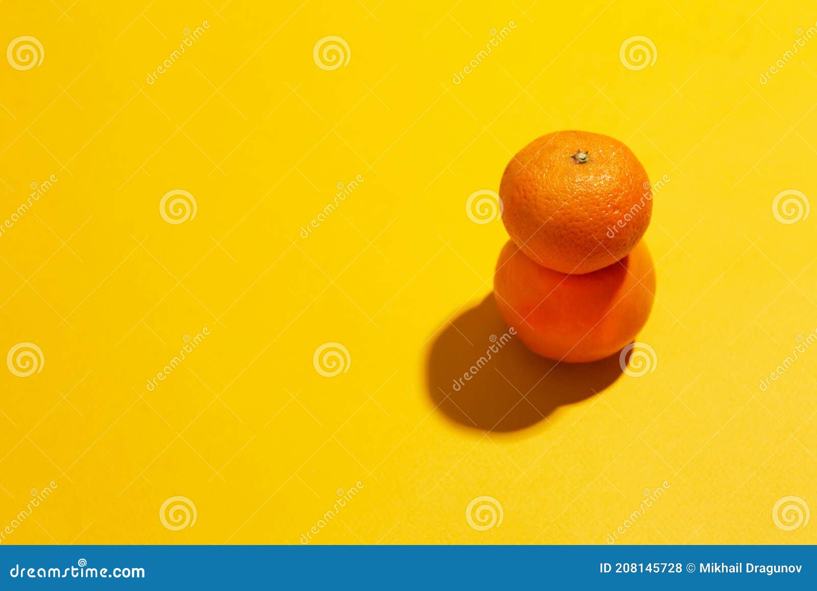 Mandarins with Leaves in Stack on Orange Background Stock Photo - Image ...