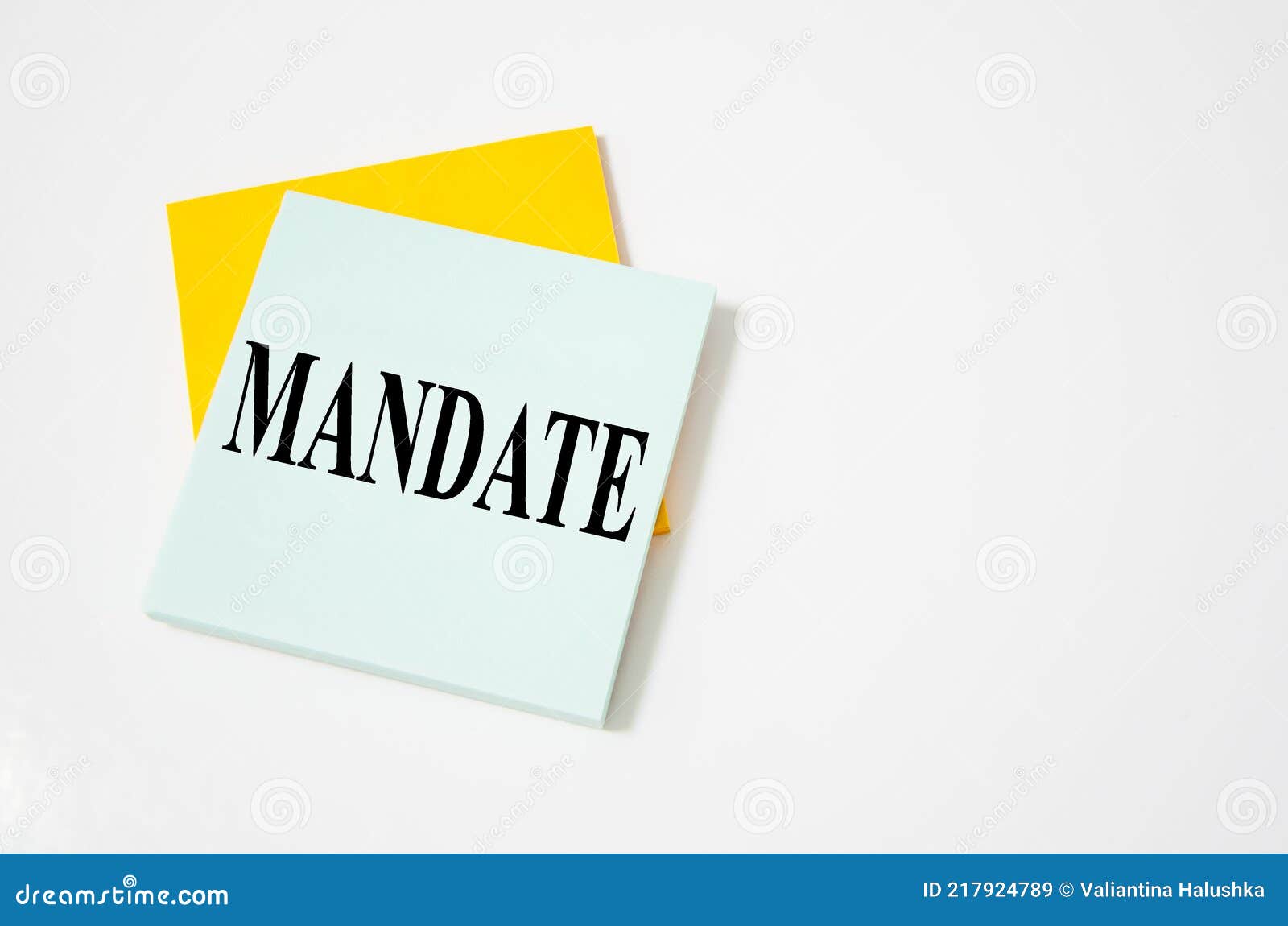 Mandate Text Written on a White Notepad with Colored Pencils and a ...