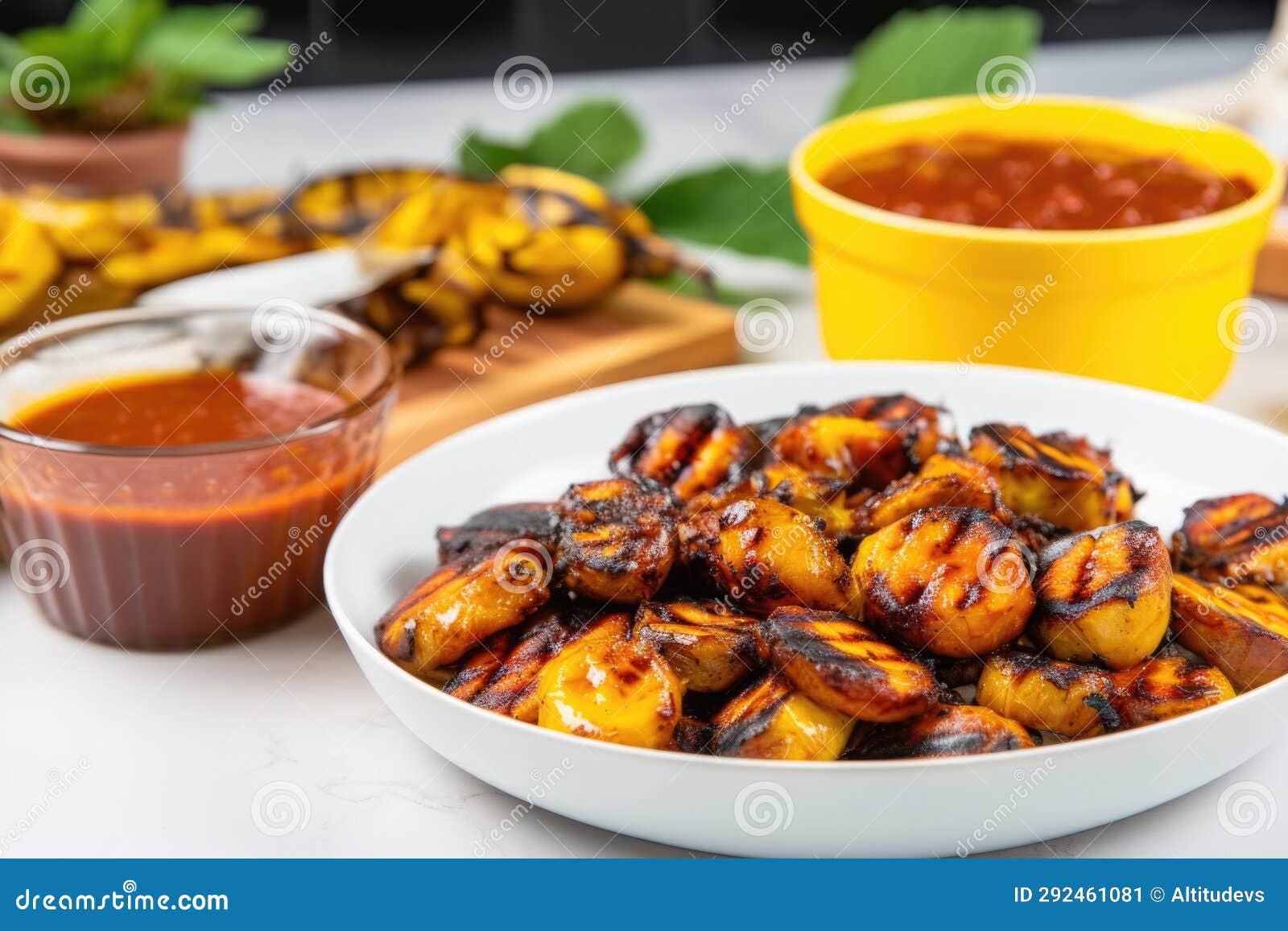 Mango Bbq Sauce in a Bowl with Grilled Plantains at the Side Stock ...