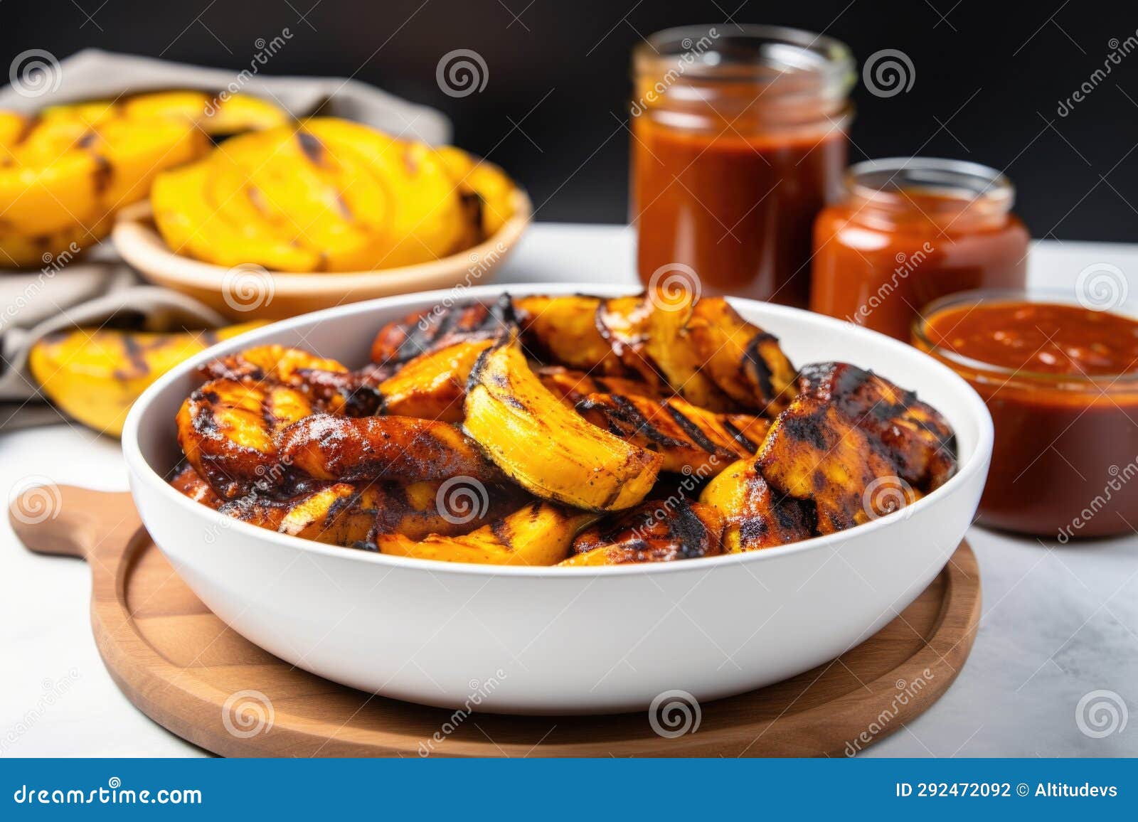 Mango Bbq Sauce in a Bowl with Grilled Plantains at the Side Stock ...