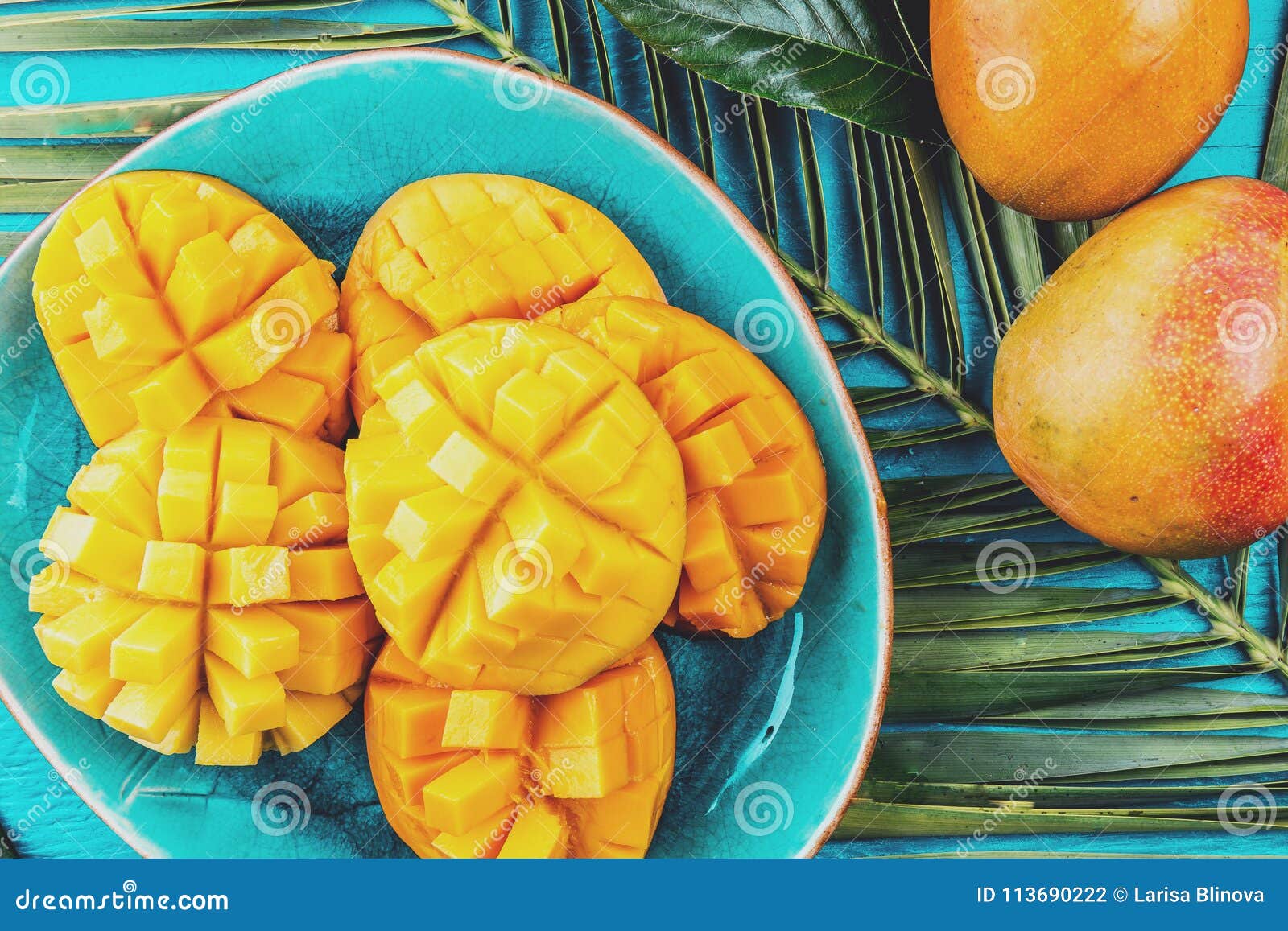 Mango on Blue Plate. Blue Background, Palm Tree Leave, Tropical Concept ...