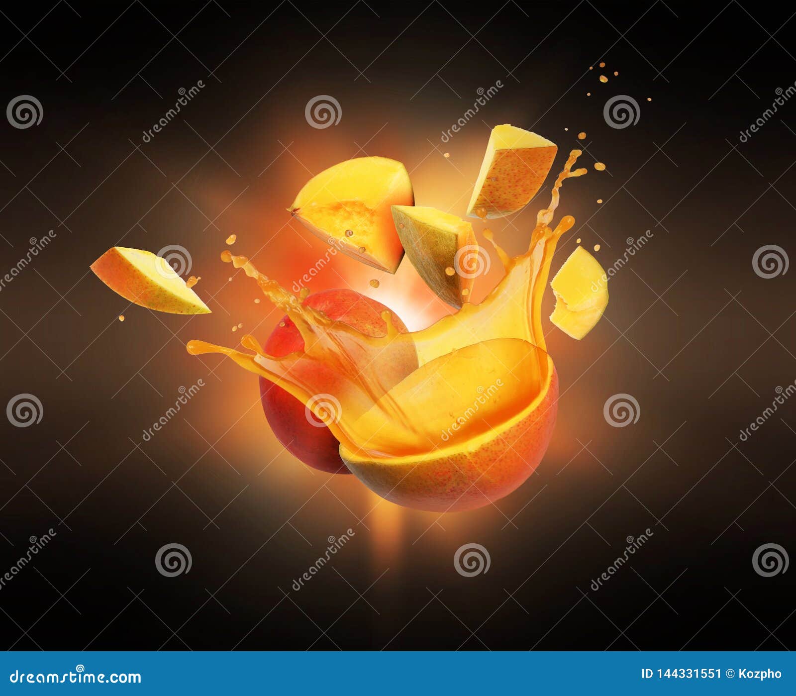 Mango Broken into Pieces with Splashes of Juice in the Dark Stock Image ...