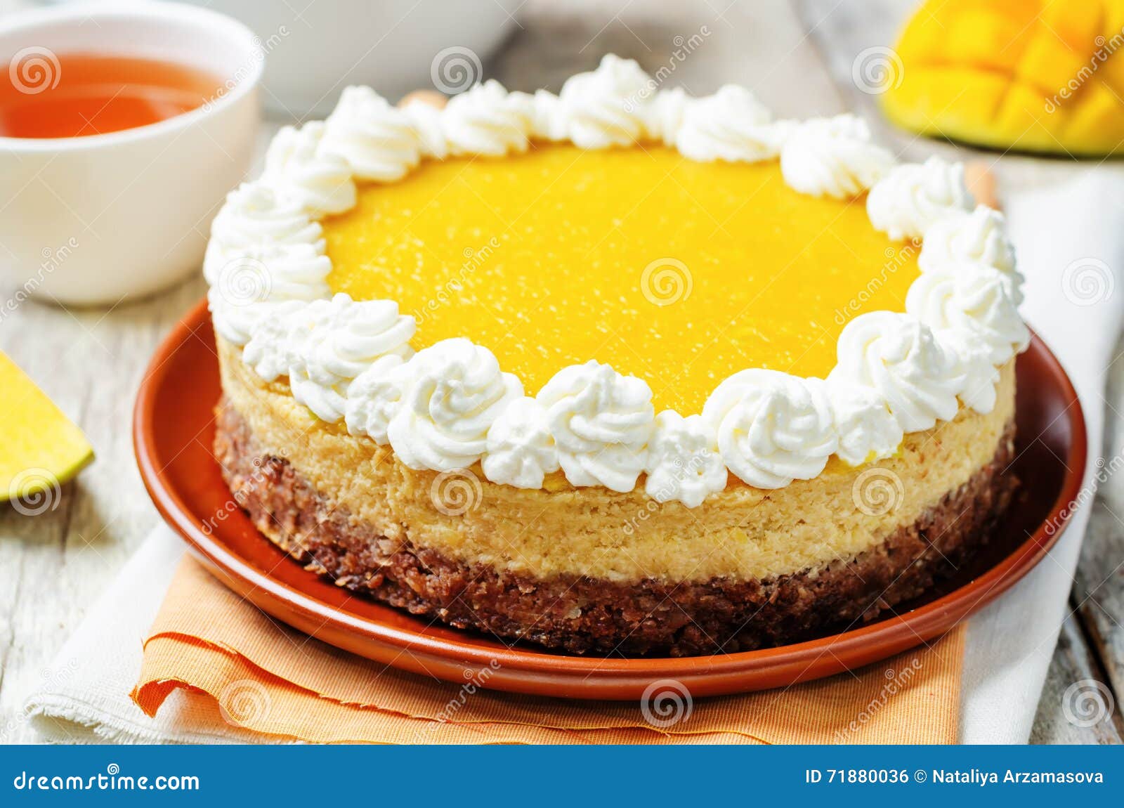 Mango Cheese Cake Decorated with Whipped Cream and Mango Puree Stock ...