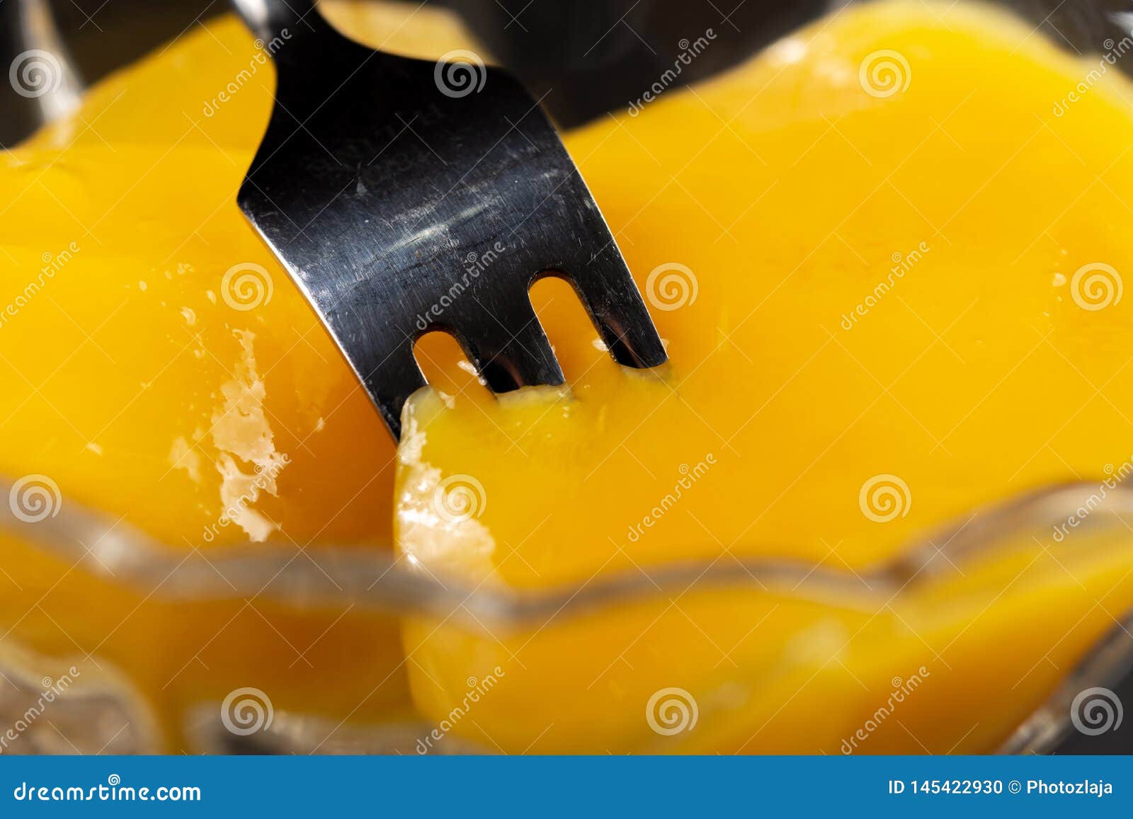 Mango Compote Closeup with Fork in the Mango Stock Photo - Image of ...