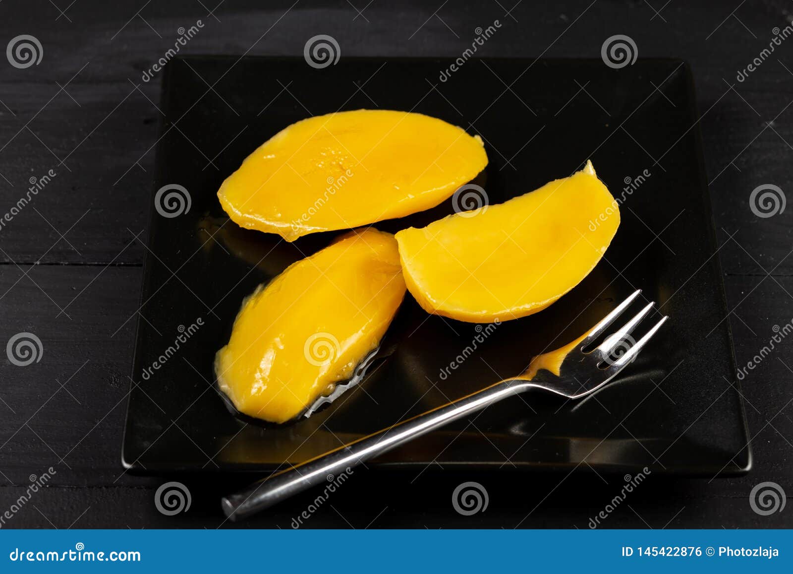 Mango Compote Served on the Plate with Fork Stock Photo - Image of ...