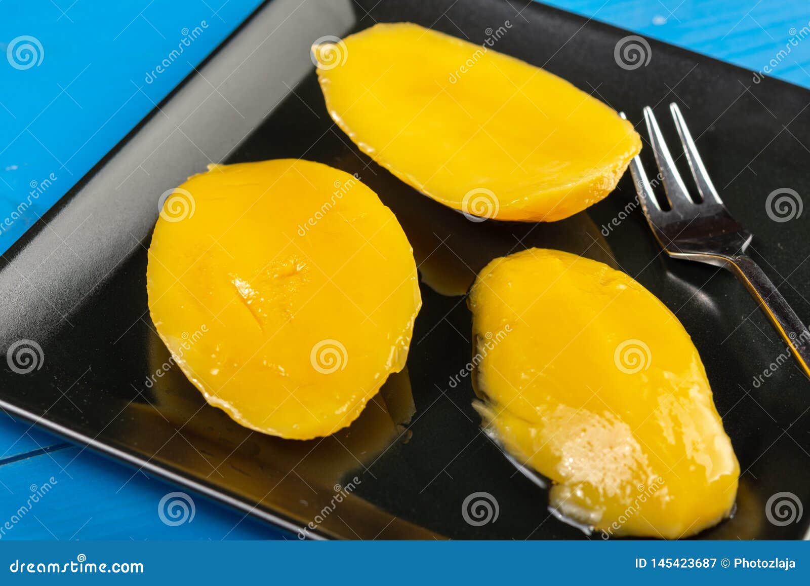 Mango Compote Served on the Plate with Fork Stock Image - Image of ...