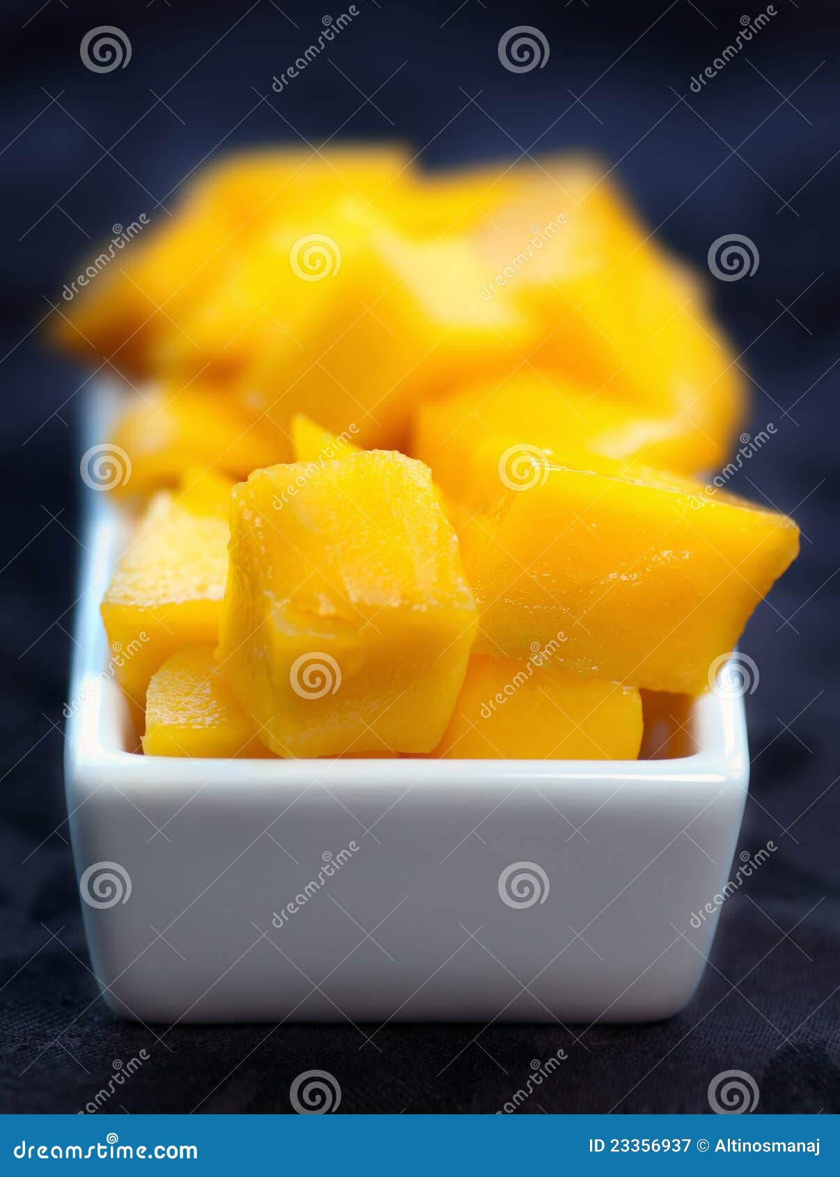 Mango Cubes on a White Dish Stock Image - Image of juicy, white: 23356937