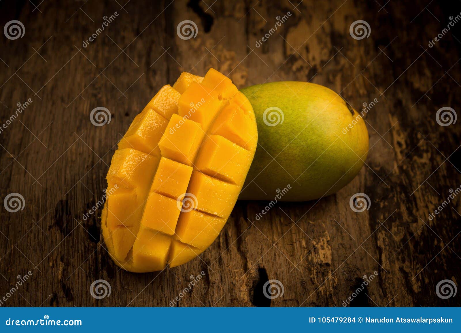 Mango On A Dark Wood Background Stock Photo - Image of color, cubes ...