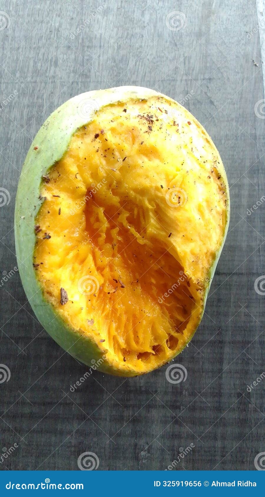 Mango Fruit from Being Bitten by a Squirrel Stock Photo - Image of ...