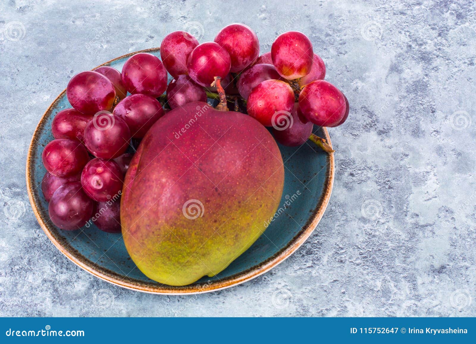 Mango and grapes on plate stock image. Image of background - 115752647