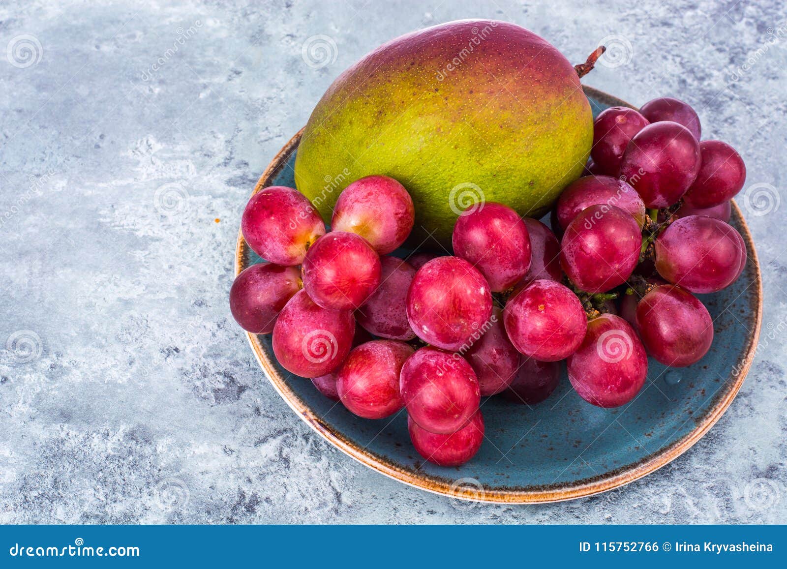 Mango and grapes on plate stock photo. Image of organic - 115752766