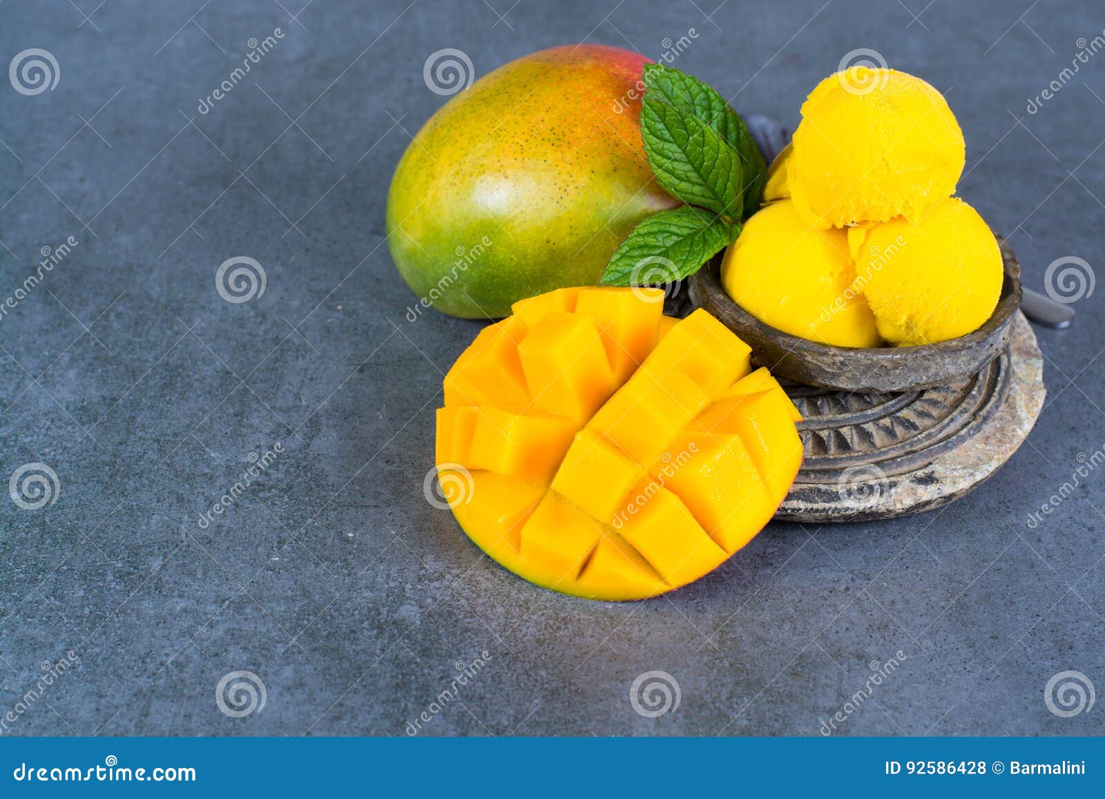 Mango Ice Cream Sorbet with Mint Leaves and Mango Fruit in Black Stock ...
