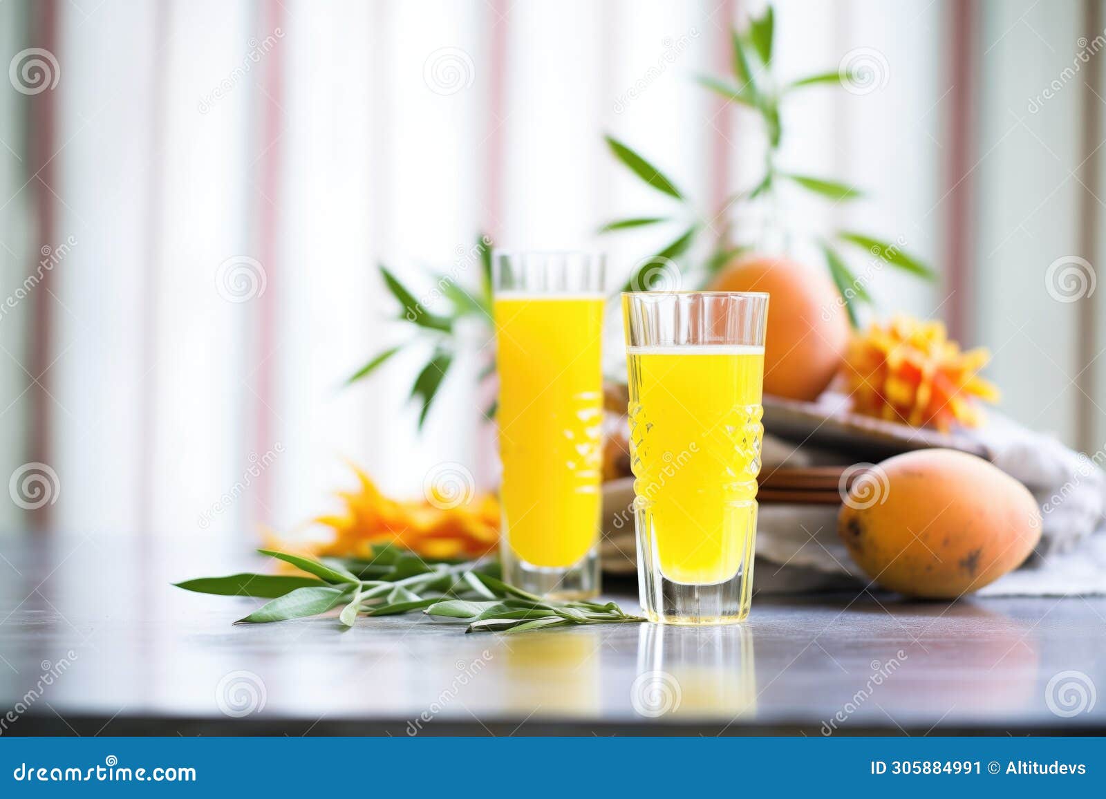 Mango Juice in Elegant Flute Glass, Stack of Mangoes in Soft Focus ...