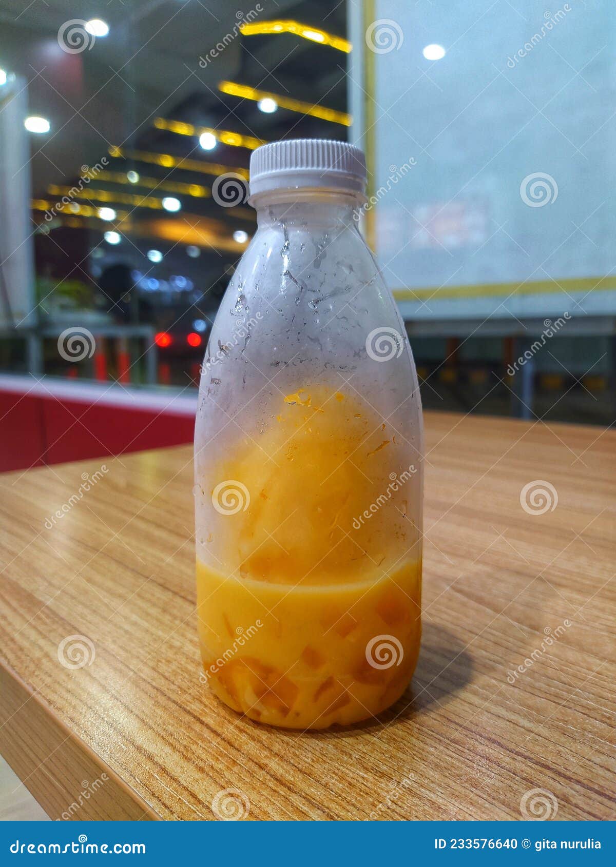 Mango Juice with Jelly Served in a Clear Plastic Bottle Stock Photo ...