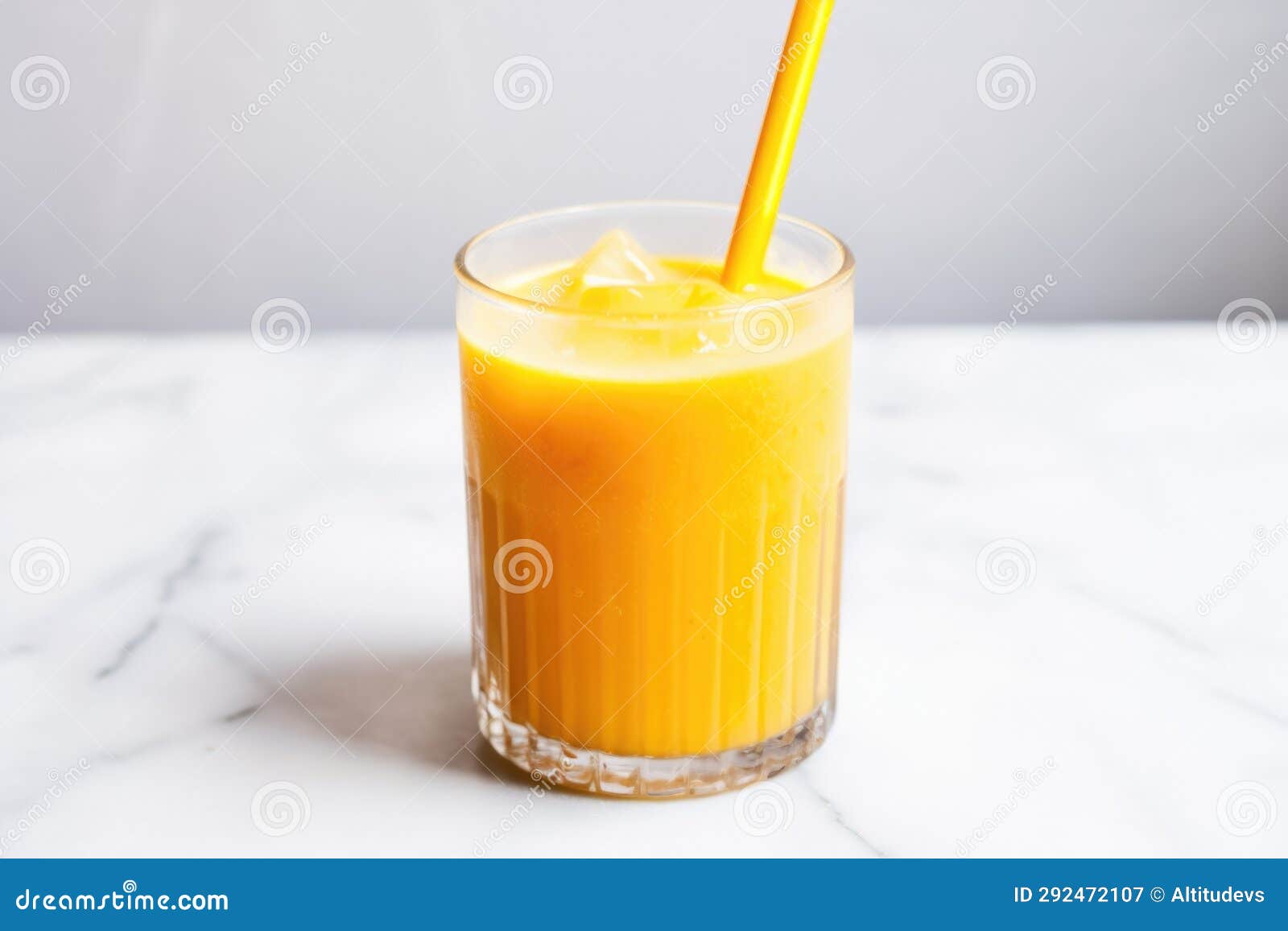 Mango Lassis Side Profile with a Transparent Straw Poking Out Stock ...